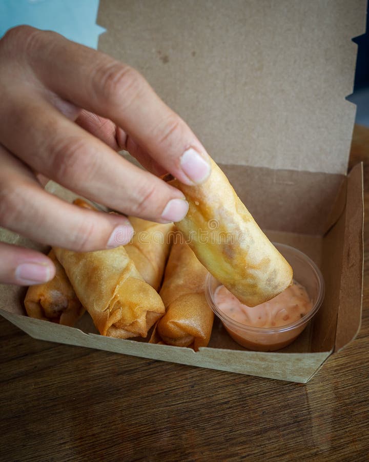 Fried Spring Rolls in a Brown Takeaway Container with Creamy Sauce ...