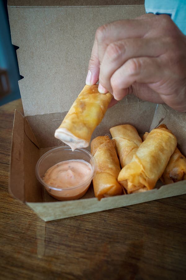 Fried Spring Rolls in a Brown Takeaway Container with Creamy Sauce ...