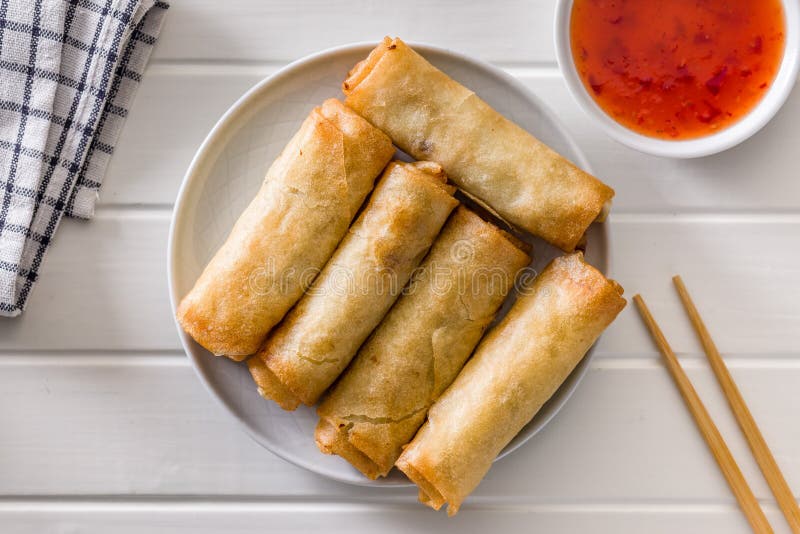 Fried Spring Rolls on Plate on White Table. Top View Stock Photo ...