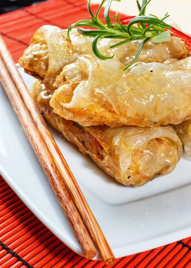 Fried Spring Rolls on Red Bamboo Mat Stock Photo - Image of crispy ...