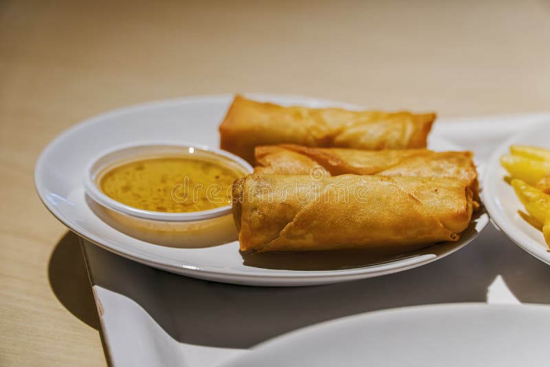 Fried Spring Rolls with Red Chilli Sauce, Tomato and Lettuce Stock ...