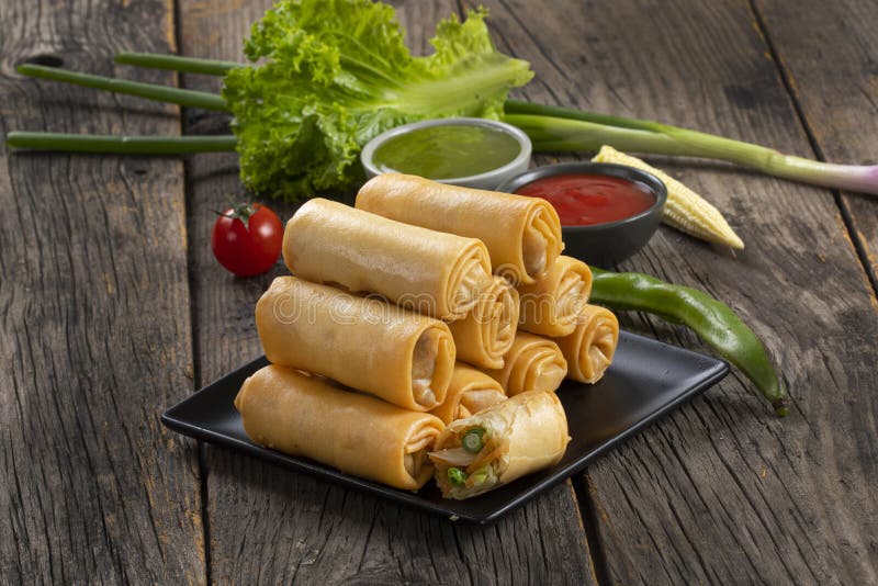 Fried Spring Rolls with Sweet Chili Sauce and Lime on Plate Stock Photo ...