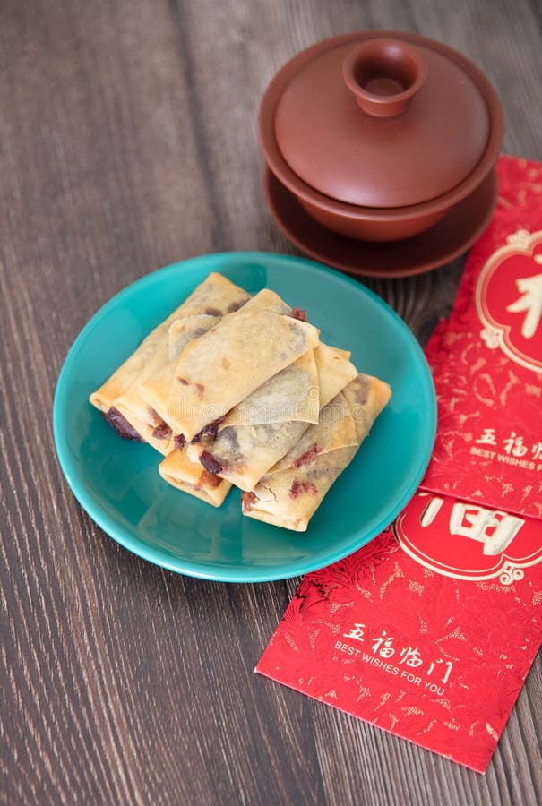 Fried Spring Rolls, Tea and Red Envelopes on the Table at the Beginning ...