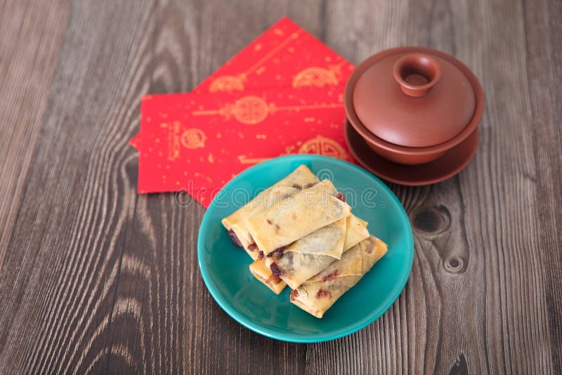 Fried Spring Rolls, Tea and Red Envelopes on the Table at the Beginning ...