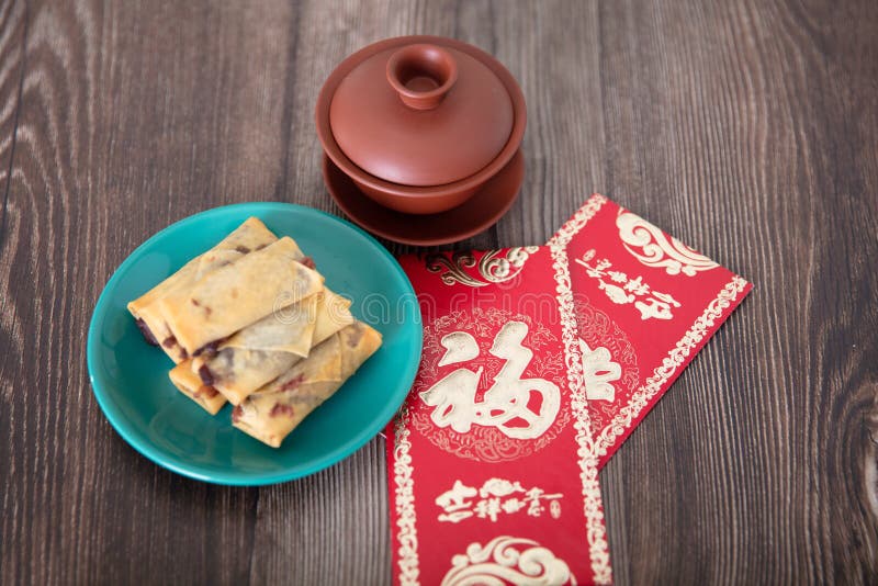 Fried Spring Rolls, Tea and Red Envelopes on the Table at the Beginning ...