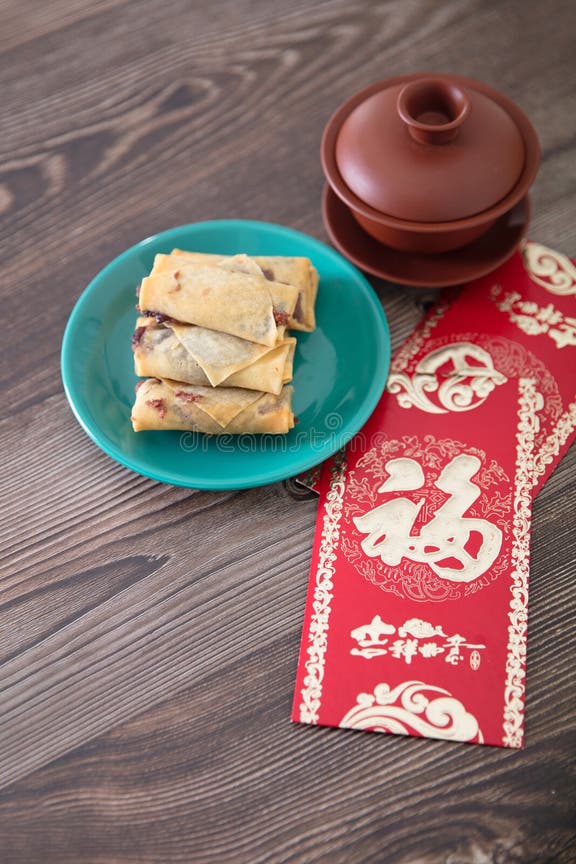 Fried Spring Rolls, Tea and Red Envelopes on the Table at the Beginning ...