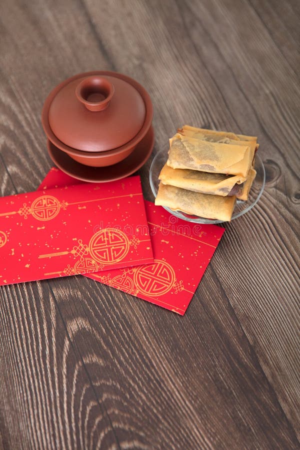 Fried Spring Rolls, Tea and Red Envelopes on the Table at the Beginning ...