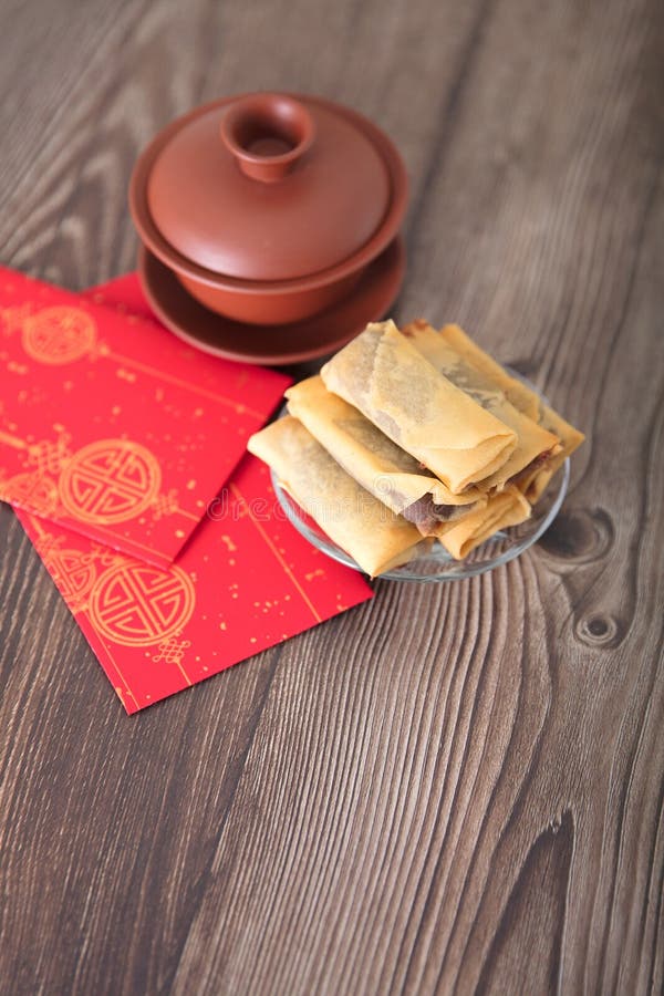 Fried Spring Rolls, Tea and Red Envelopes on the Table at the Beginning ...