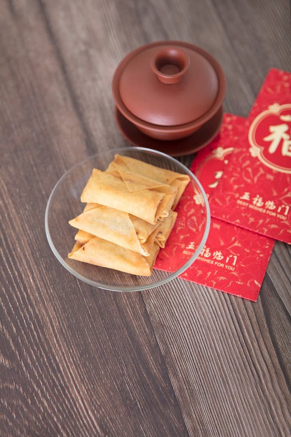 Fried Spring Rolls, Tea and Red Envelopes on the Table at the Beginning ...