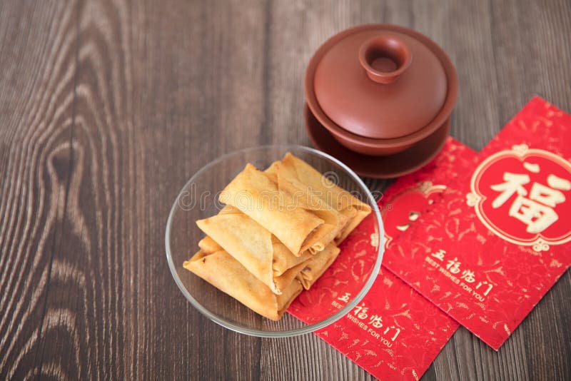 Fried Spring Rolls, Tea and Red Envelopes on the Table at the Beginning ...