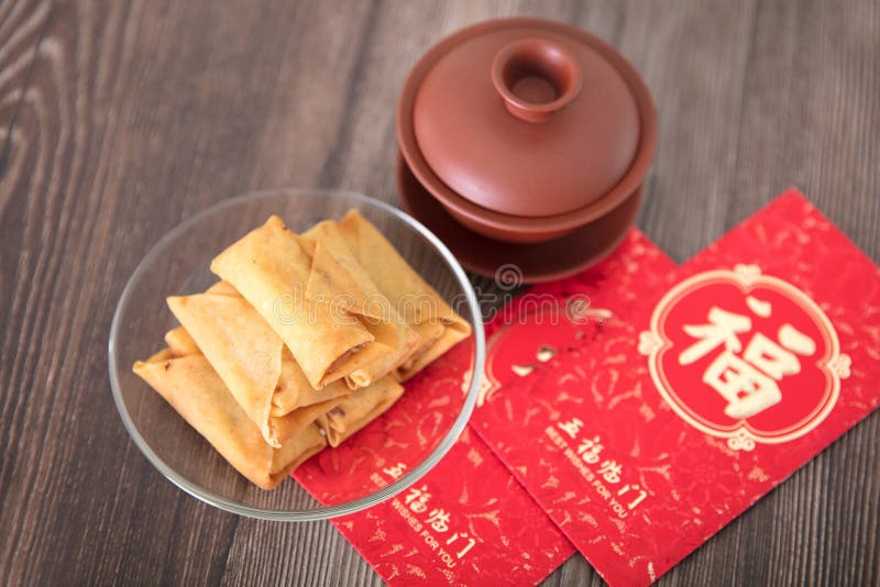 Fried Spring Rolls, Tea and Red Envelopes on the Table at the Beginning ...