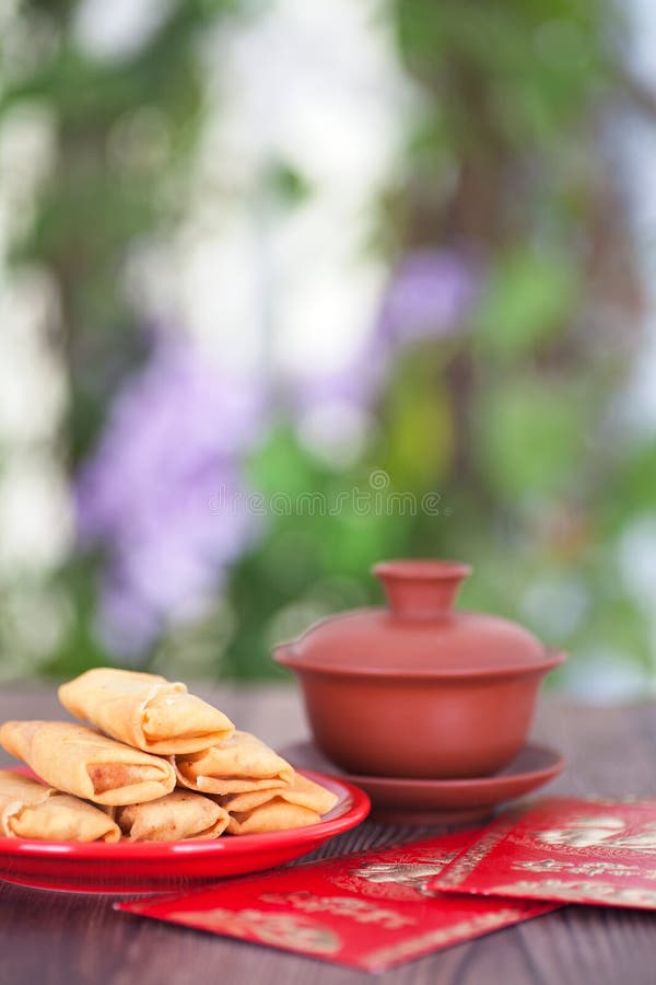 Fried Spring Rolls and Tea and Red Packets. the Chinese Characters in ...