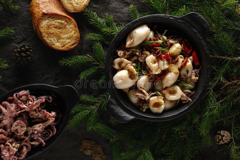 Fried Squid with Chilli Pepper, Garlic and Butter Served in Iron Cast ...