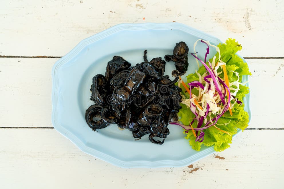 Fried Squid with Squid Ink Sauce Stock Image - Image of food ...