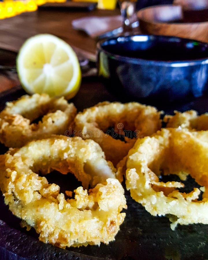 Fried Squid with Lemon at the Restaurant. Stock Photo - Image of fried ...