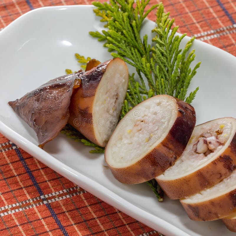 Fried Squid Rolls of Meat and Rice Sliced on White Platter on Th Stock ...