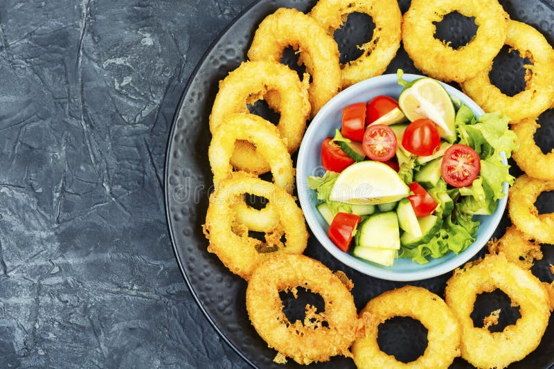 Battered Squid Rings on Plate Stock Photo - Image of heap, fried: 340626082