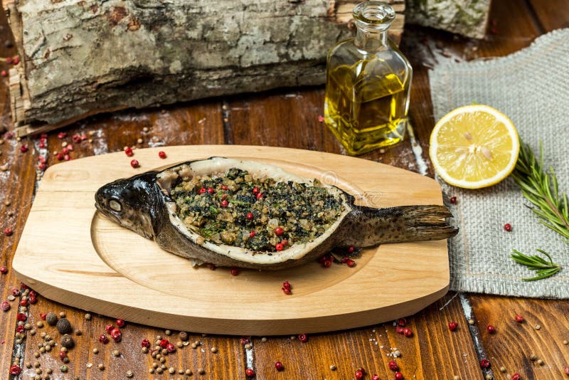 The Fried Stuffed Fish on a Wooden Table Stock Photo - Image of cooked ...