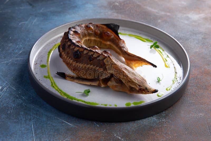 Fried Sturgeon Fish in a Plate. Close-up Stock Photo - Image of cooking ...