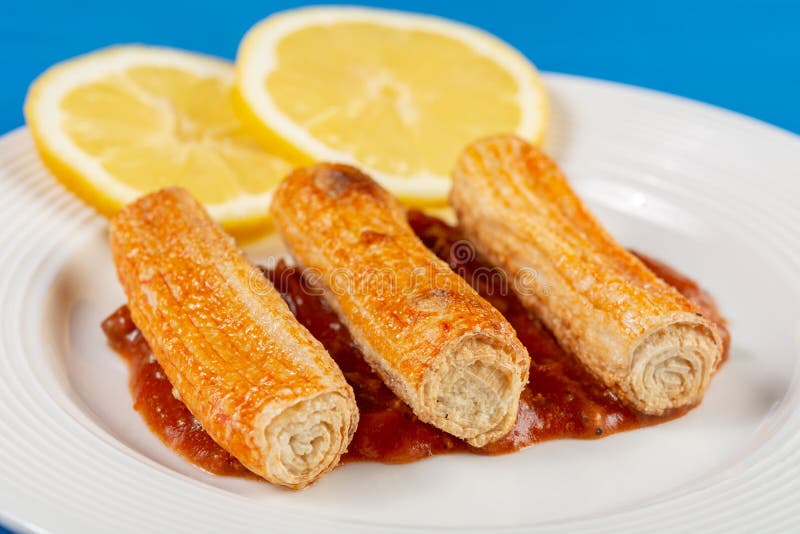 Fried Surimi Sticks with Lemons on the Blue Wooden Boards Stock Photo ...