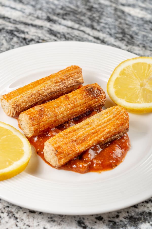 Fried Surimi Sticks with Lemons on the Grey Marble Stock Photo - Image ...