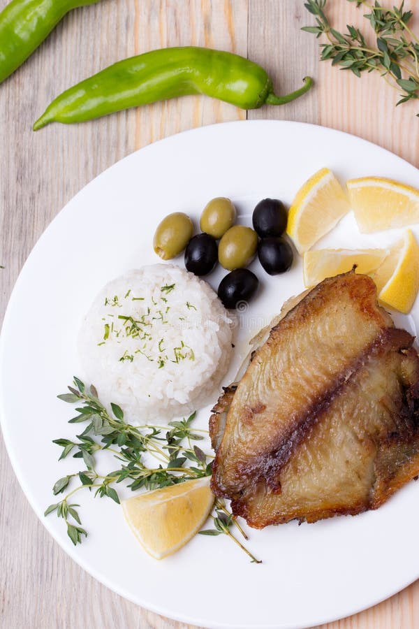 Fried Tilapia Served with Rice and Herbs Stock Image - Image of cooked ...