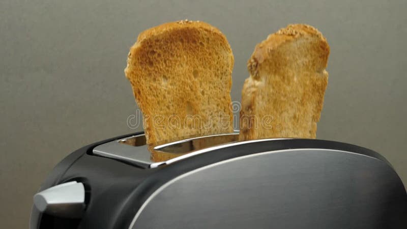 Fried Toast Bread Pops Out of a Modern Toaster, Slow Motion Stock Video ...