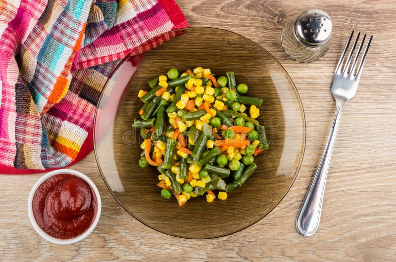 Fried Vegetable Mix in Brown Plate, Ketchup, Pepper and Fork Stock ...