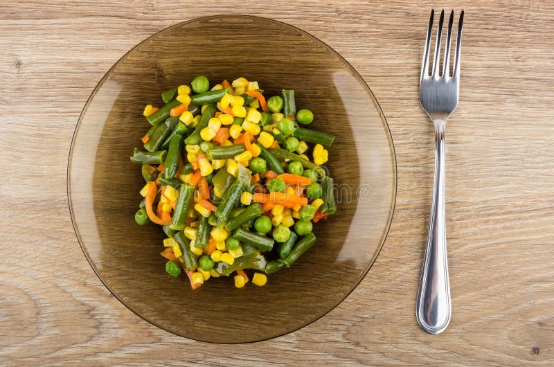 Fried Vegetable Mix in Brown Transparent Plate and Fork Stock Image ...