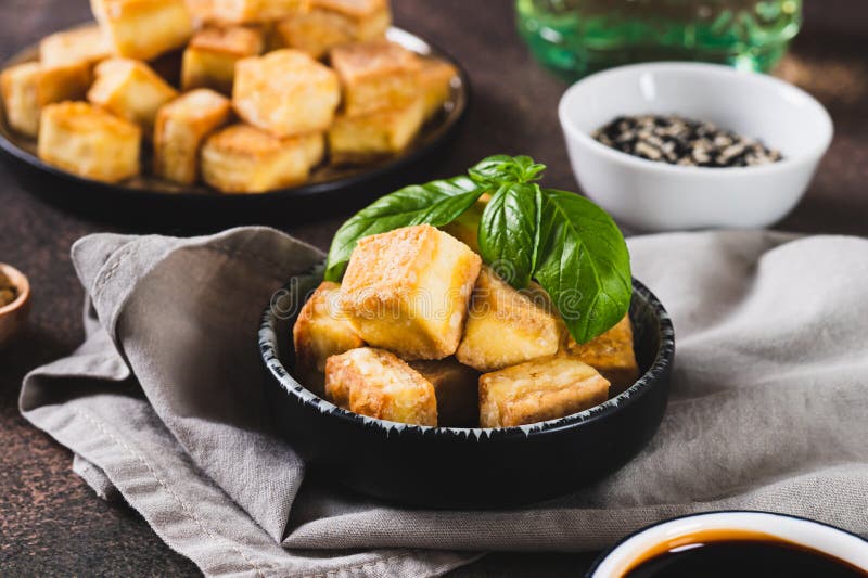 Fried Vegetarian Tofu Cheese Cubes and Basil Leaves in Bowl on Table ...