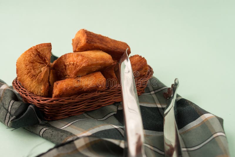 Fried yucca in a basket stock photo. Image of isolated - 234189742