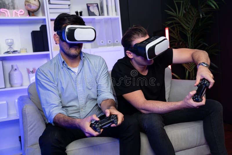 Friend Gamers Playing Video Game Using Joysticks and VR Headset ...