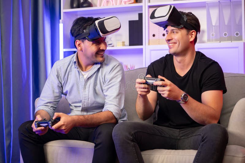 Friend Gamers Playing Video Game Using Joysticks and VR Headset ...