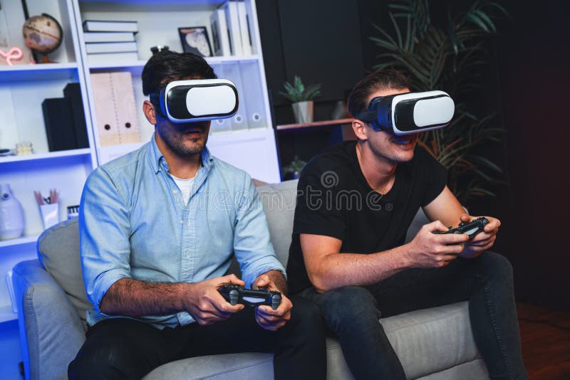 Friend Gamers Playing Video Game Using Joysticks and VR Headset ...