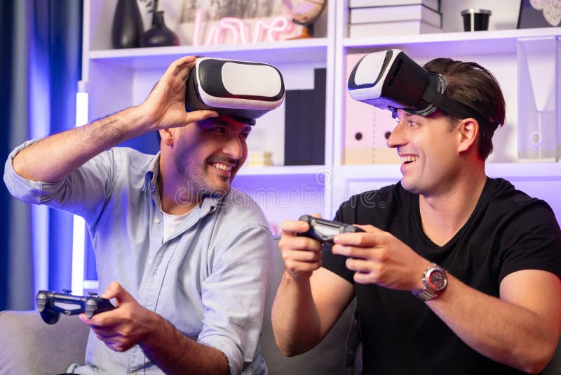 Friend Gamers Playing Video Game Using Joysticks and VR Headset ...