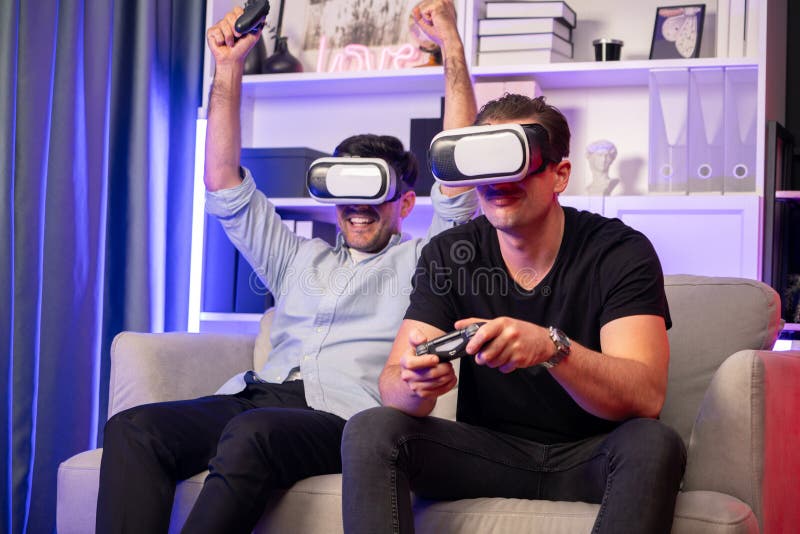 Friend Gamers Playing Video Game Using Joysticks and VR Headset ...