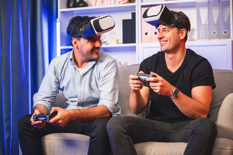 Friend Gamers Playing Video Game Using Joysticks and VR Headset ...
