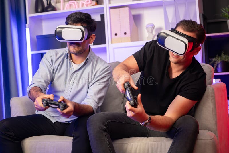 Friend Gamers Playing Video Game Using Joysticks and VR Headset ...