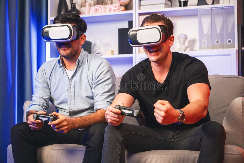Friend Gamers Playing Video Game Using Joysticks and VR Headset ...