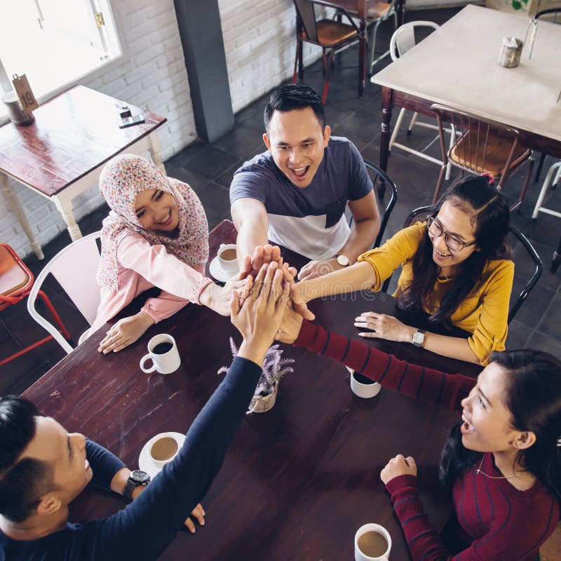 Friend Giving High Five at Cafe Stock Image - Image of cafe, boys: 69382503