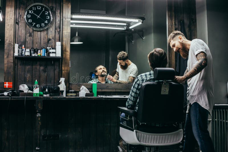 Friendly Barber Smiling and Combing Beard of His Client Stock Photo ...