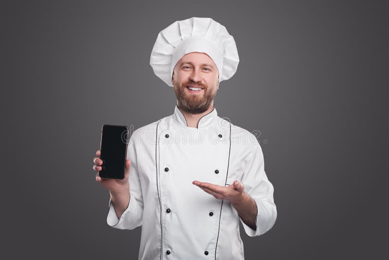 Cheerful Chef Demonstrating Smartphone with Blank Screen Stock Image ...