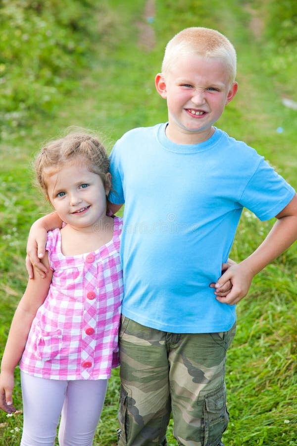 Friendly boy and girl stock photo. Image of happy, green - 25310064