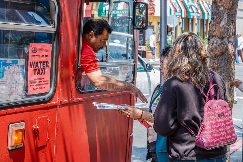 Friendly Bus Driver Explains the Female Tourists the Way by Using a Map ...