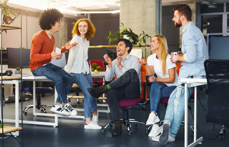 Friendly Business Team Talking at Coworking Space Stock Photo - Image ...