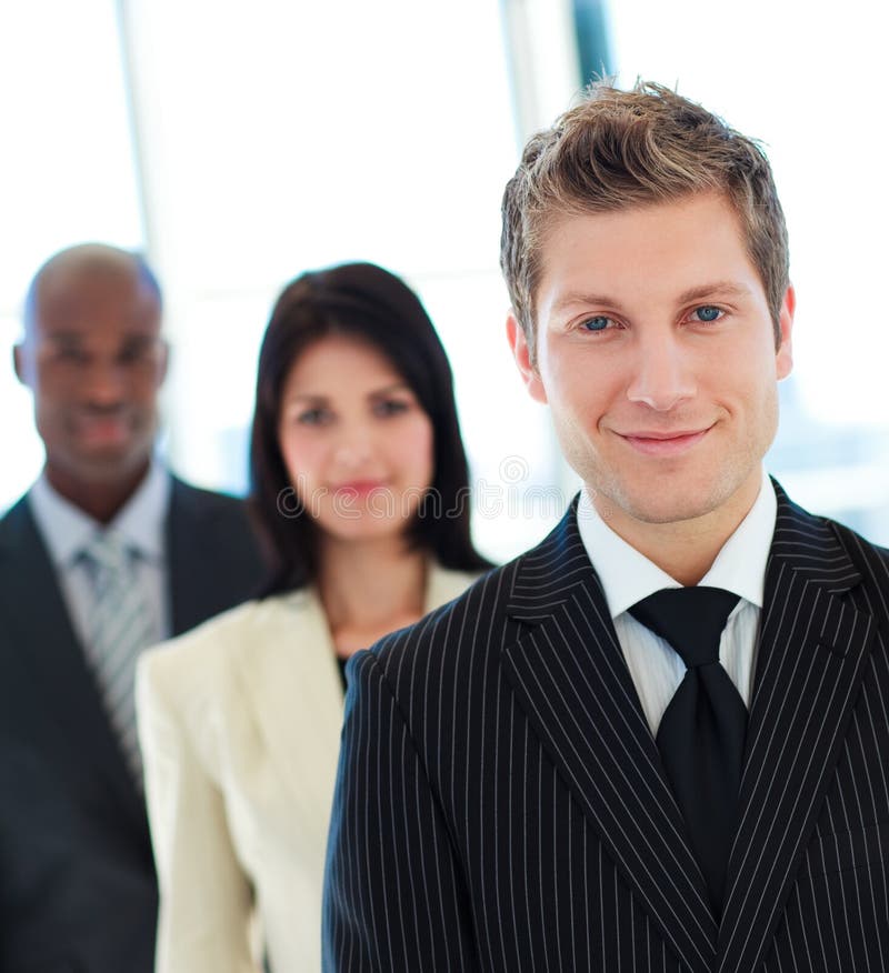 Friendly Businessman in Front of His Team Stock Photo - Image of ...