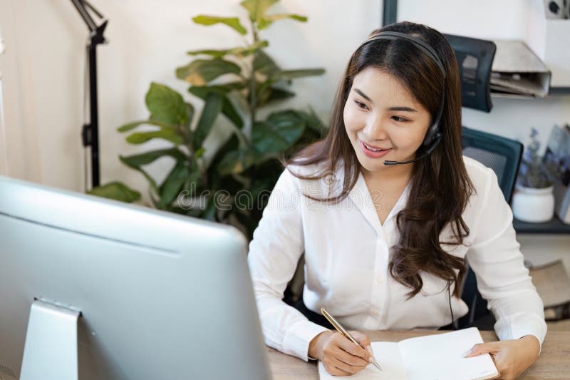 Friendly Call Center Agent Providing Customer Support with Headset in Modern Office Environment ...