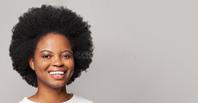 Friendly Cheerful Attractive Curly Haired Young Woman Smiling Pleasant