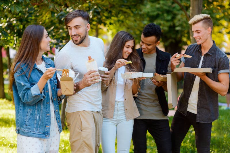 Friendly Co-workers Dining at Park Stock Photo - Image of five, love ...