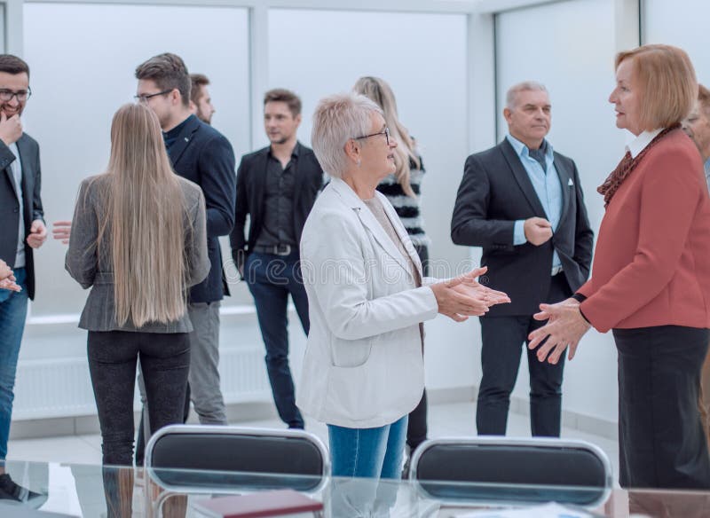 Friendly Colleagues Consulting after Working Meeting Stock Image ...